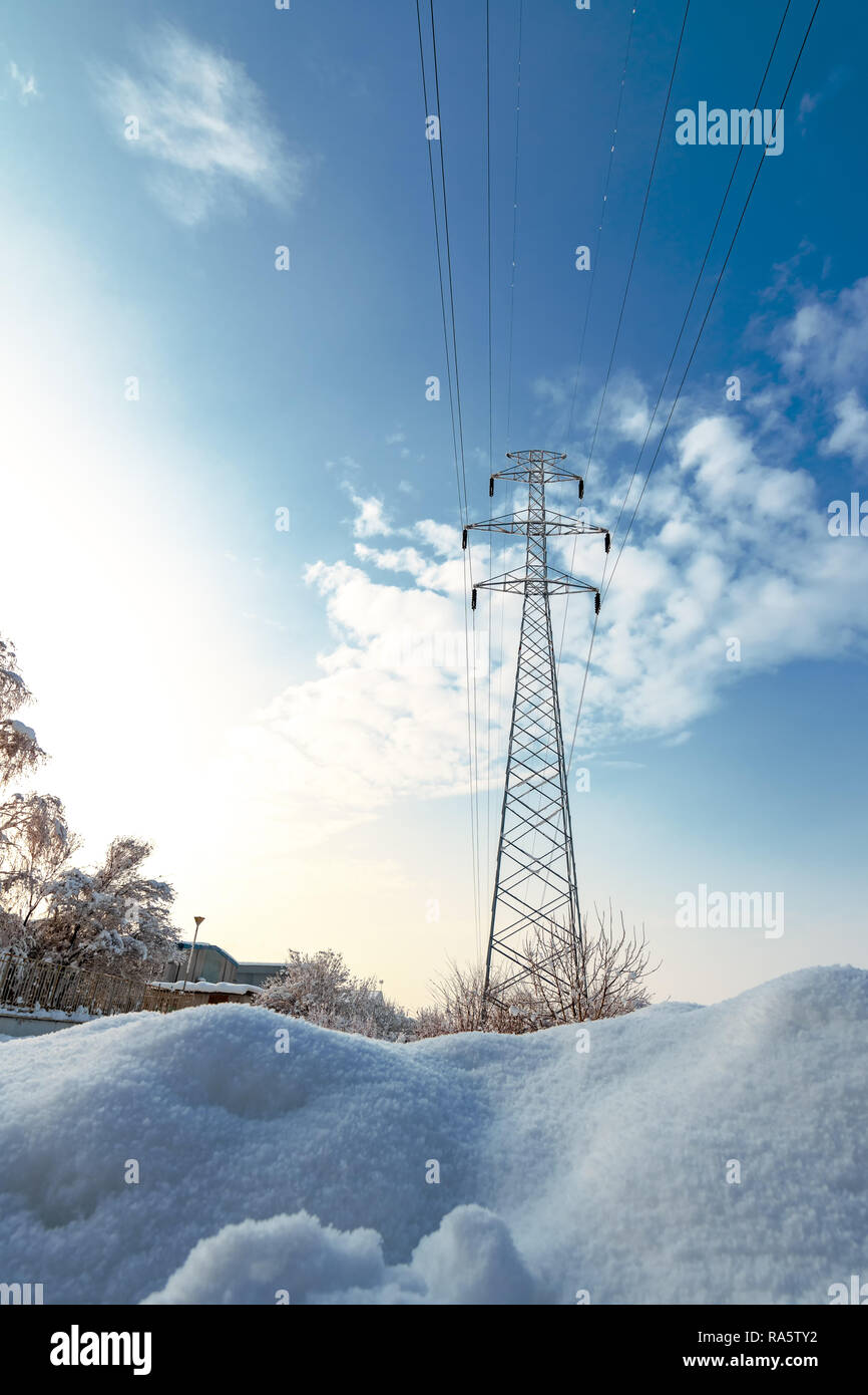 Electricity pylon in snow, winter scenery with lonely pole for power ...