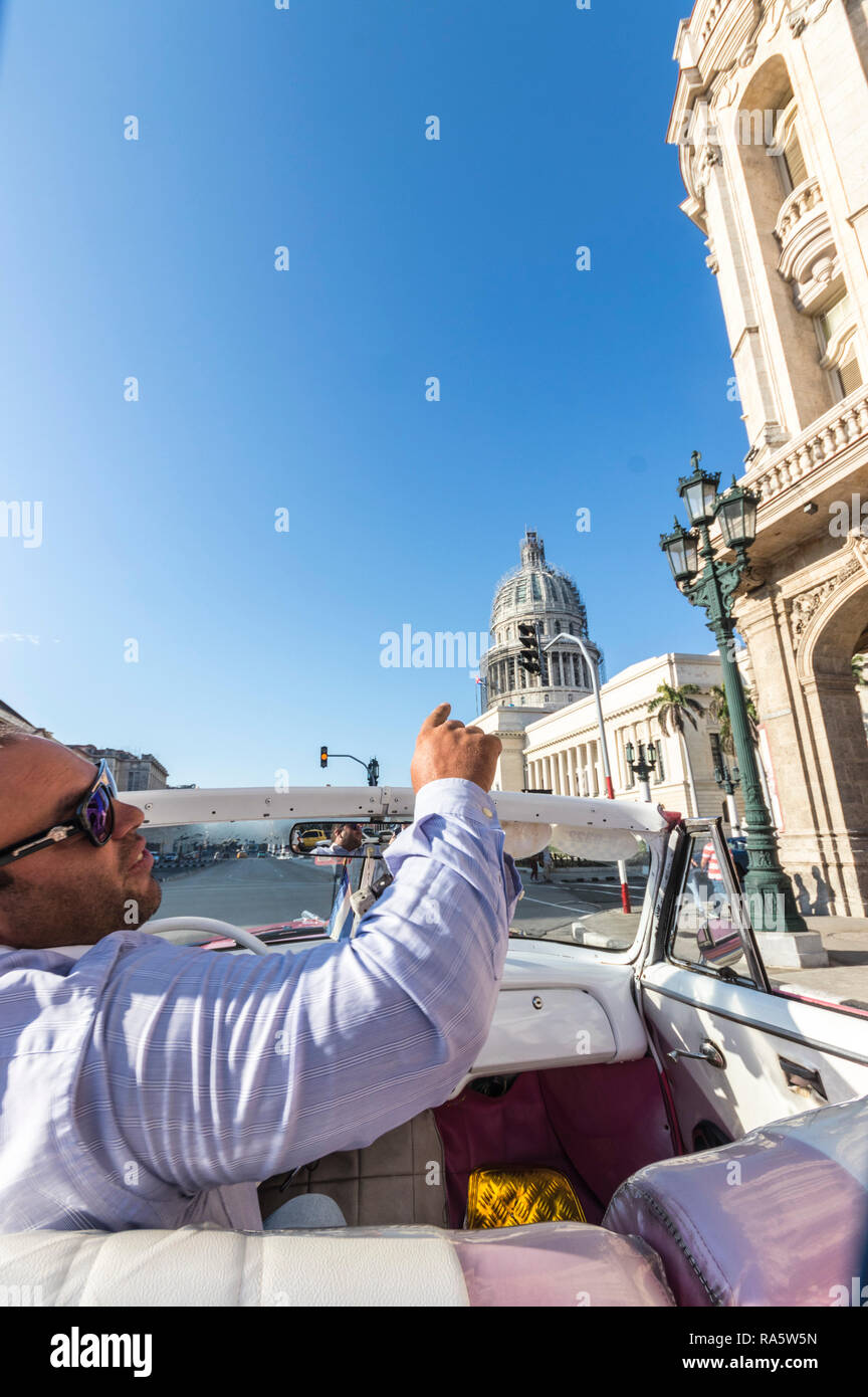 taxi driver in classic vintage 1950s open top car in Havana, Cuba ...