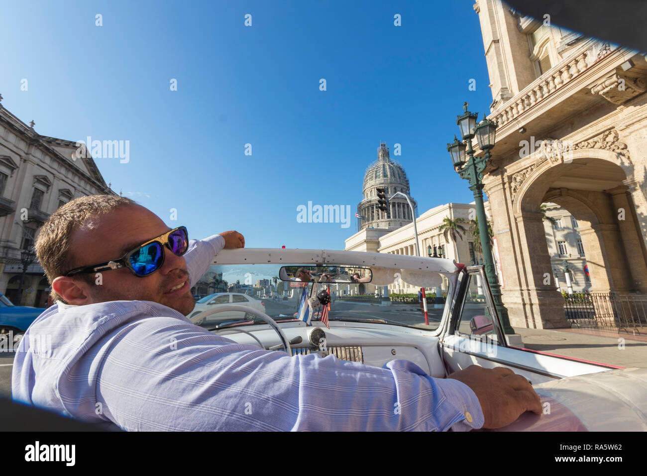 taxi driver in classic vintage 1950s open top car in Havana, Cuba ...