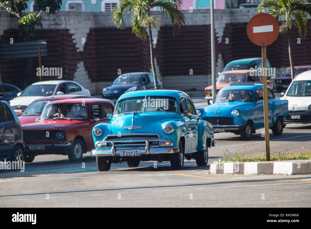 classic vintage American cars driving in Havana, Cuba, Caribbean Stock ...
