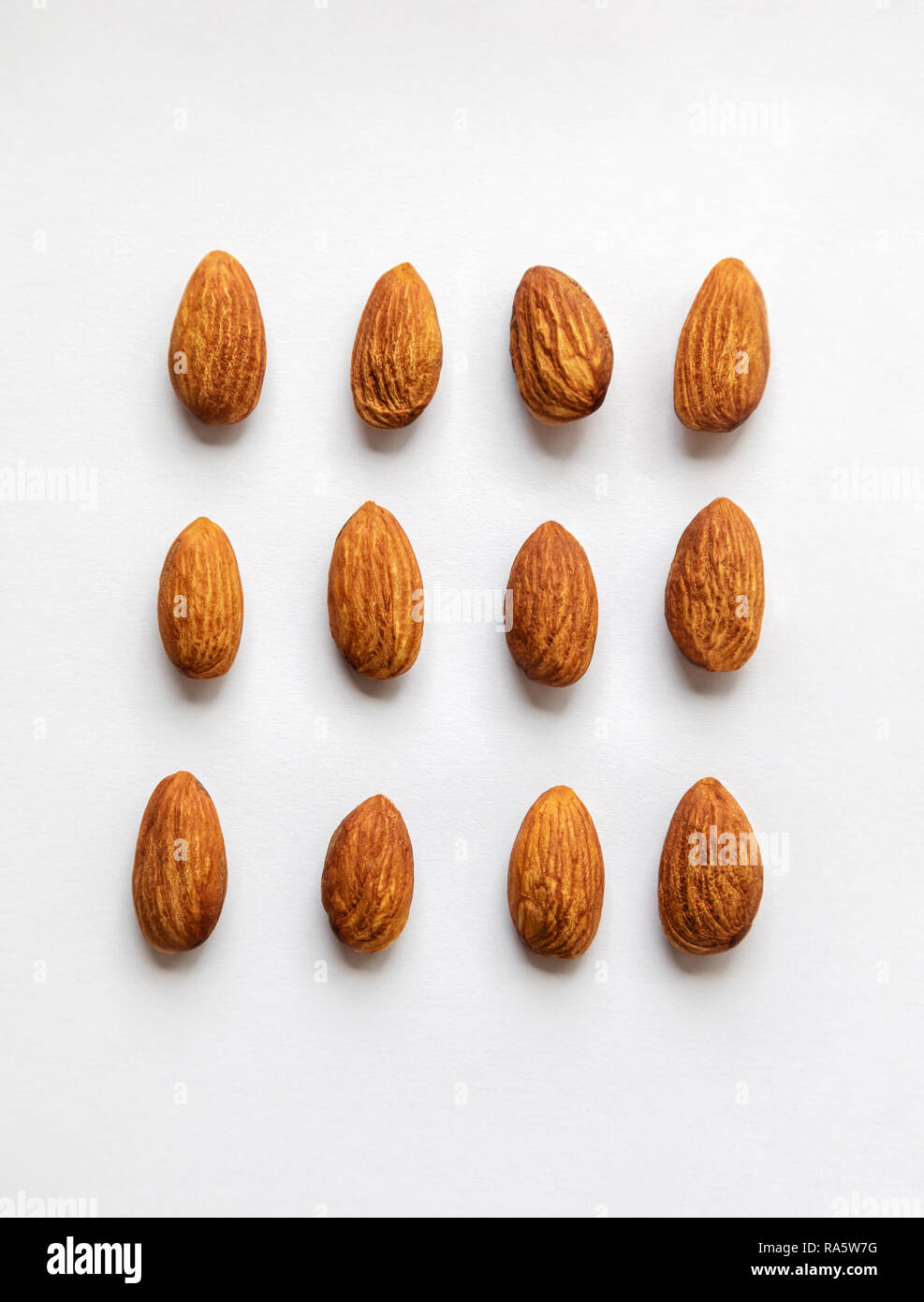 Almond on white background. Top view Stock Photo - Alamy