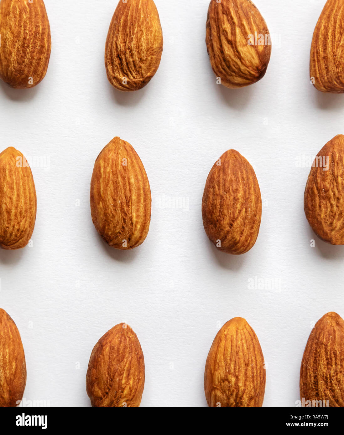 Almond on white background. Top view Stock Photo - Alamy