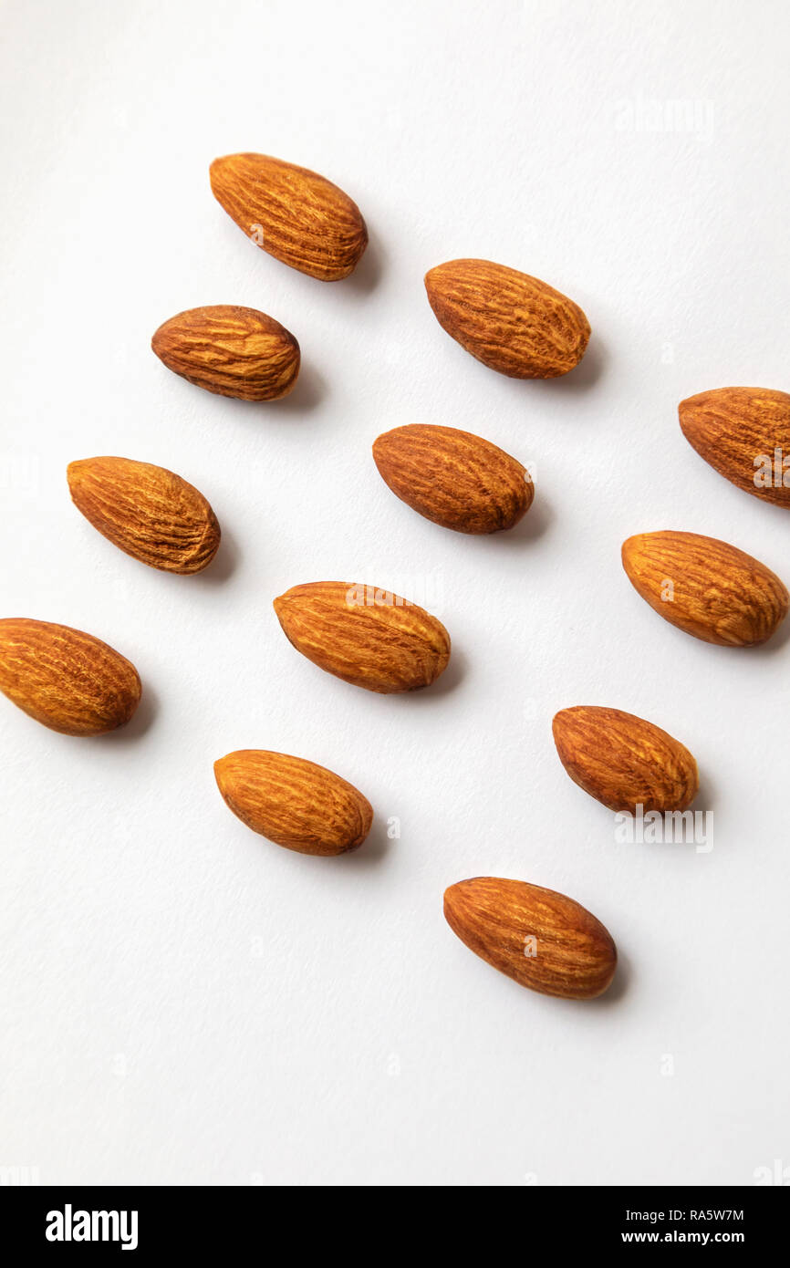 Almond on white background. Top view Stock Photo - Alamy