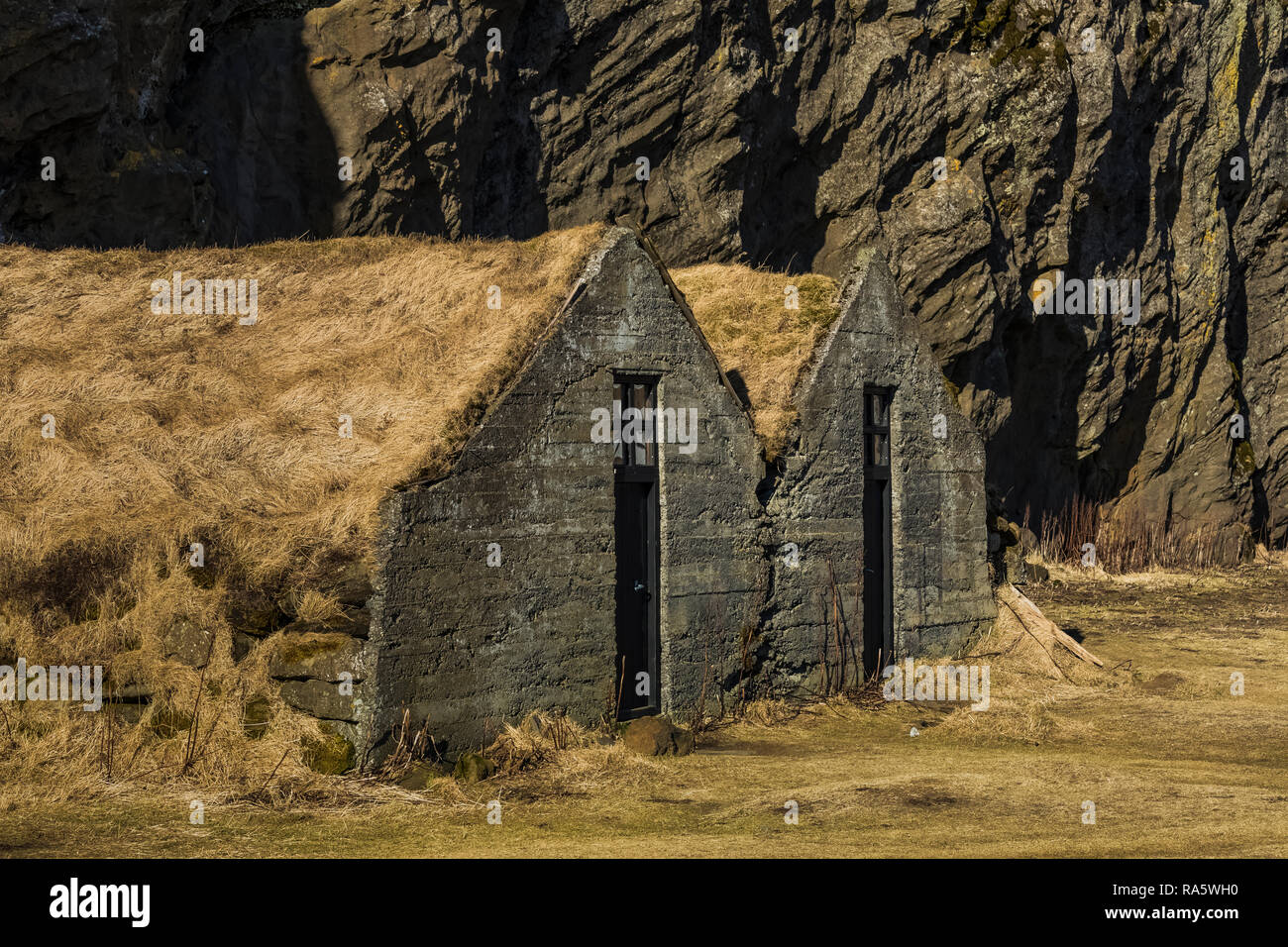 Concrete barns with sod roofs at Drangshlíð 2, at Drangurinn Rock, said ...