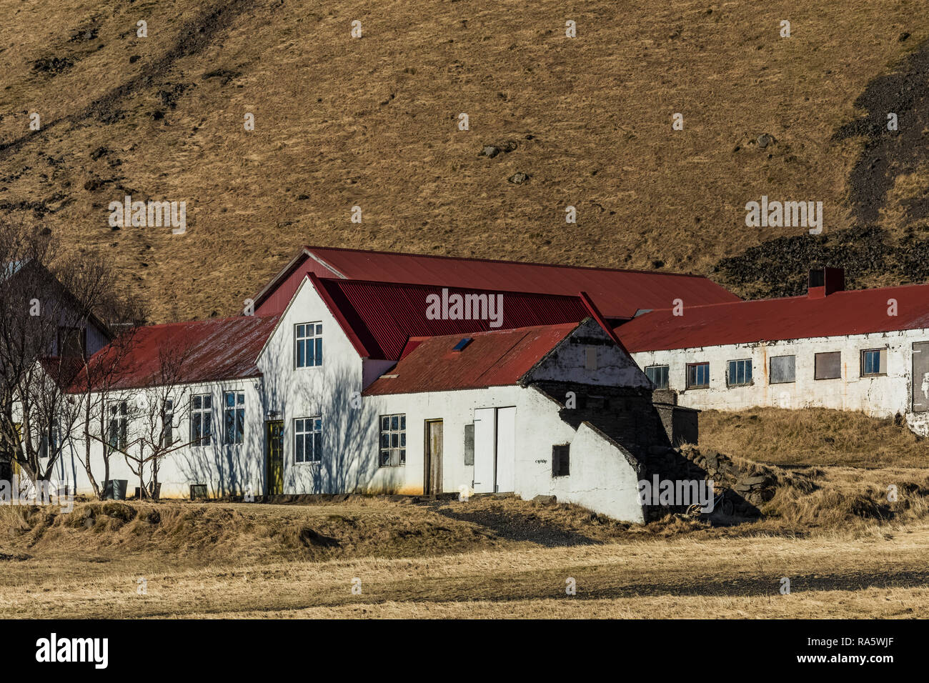 Traditional concrete barn with red roof along the South Coast of ...