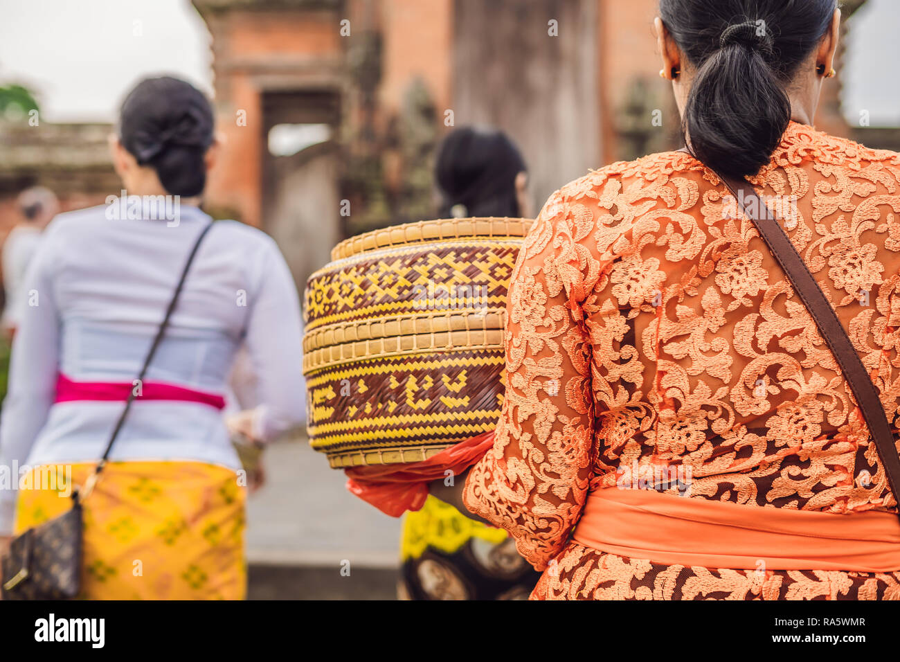 Balinese people in traditional clothes during religious ceremony at ...