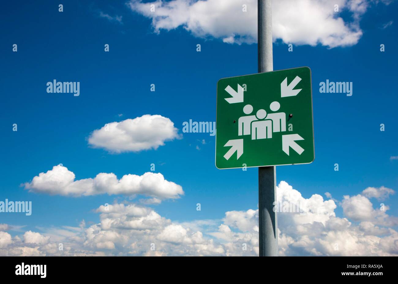 Meeting point sign on a lamppost, during the evacuation of a building ...