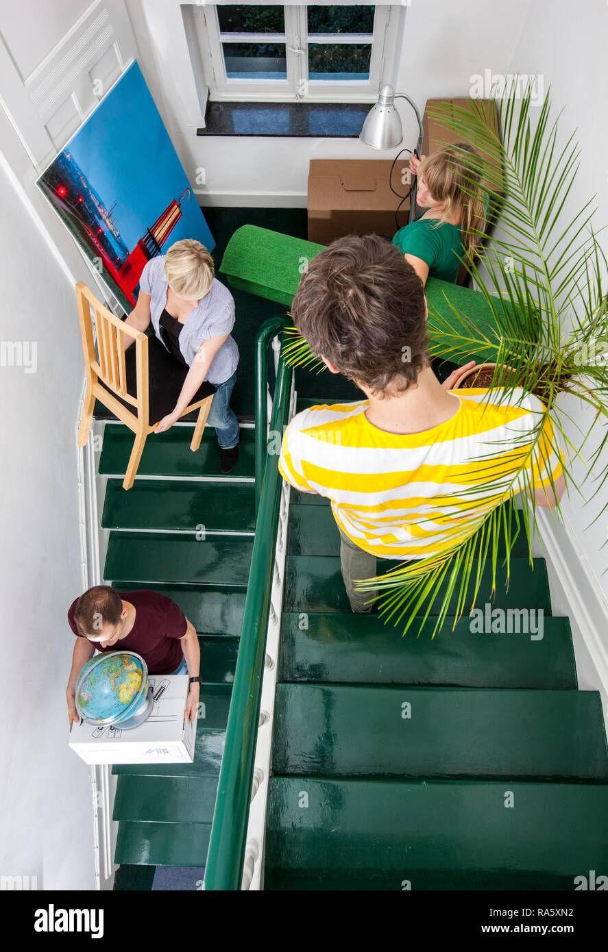 Man helping woman down stairs hi-res stock photography and images - Alamy