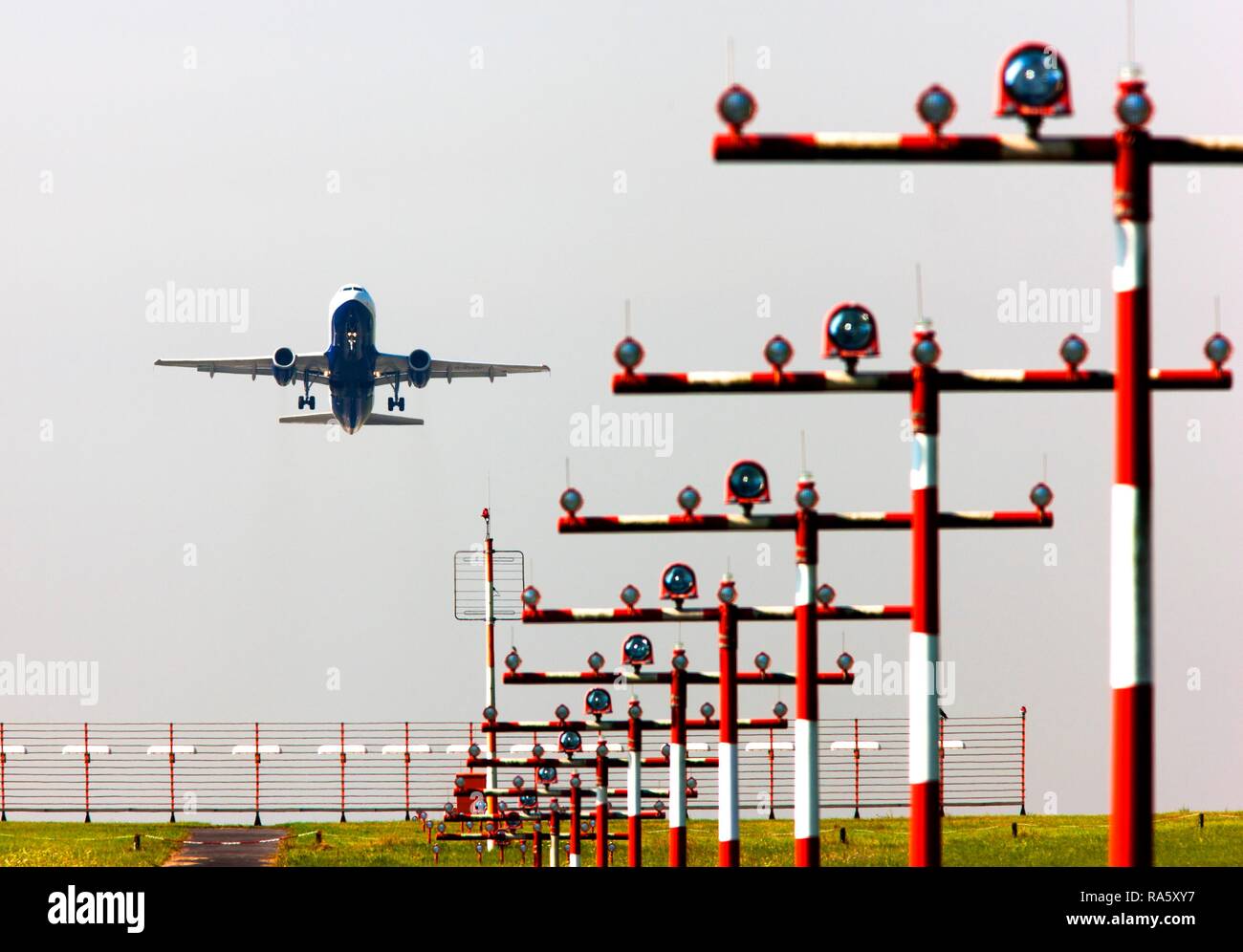 Runway landing lights in front of a British Airways Airbus A320 taking ...