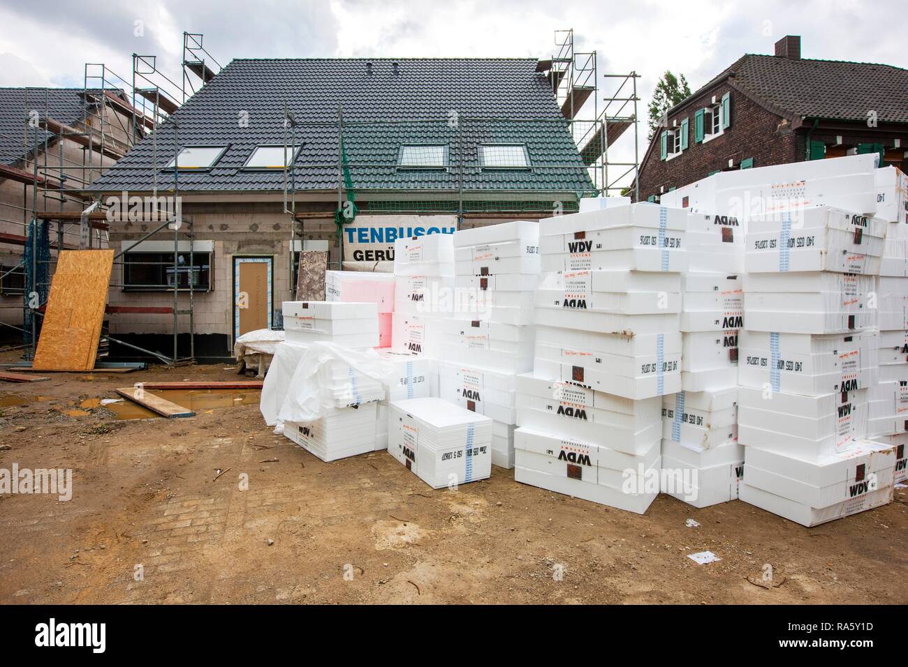 New construction of a single-family house, a stack of insulation ...