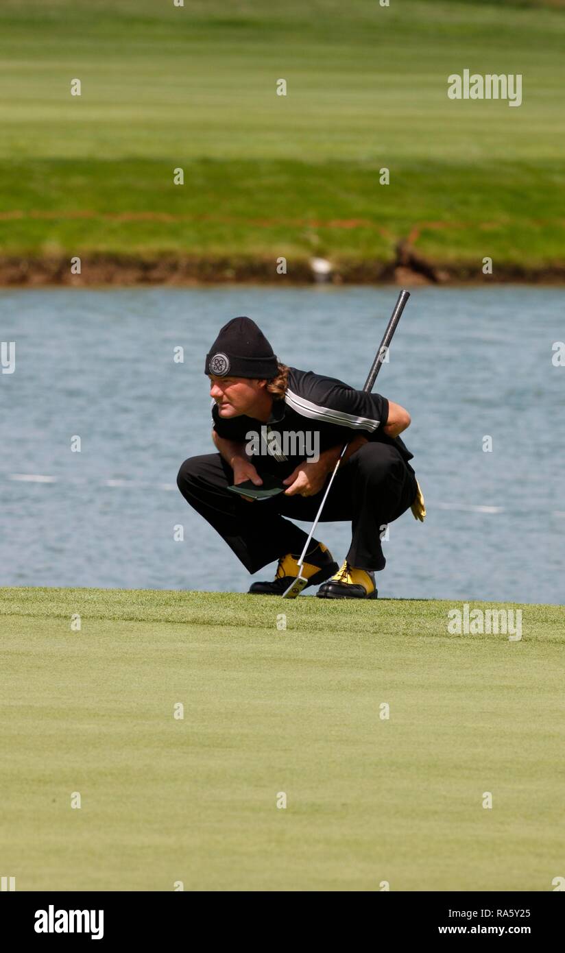 Alex Cejka, German professional golfer, reading the putting green at ...
