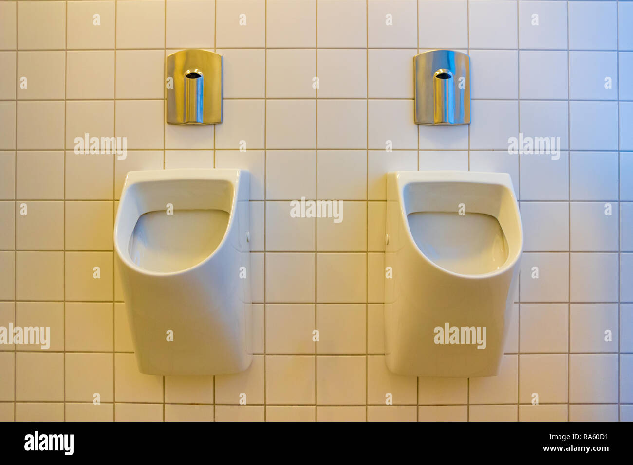A urinal is a sanitary plumbing fixture for urination only Stock Photo ...