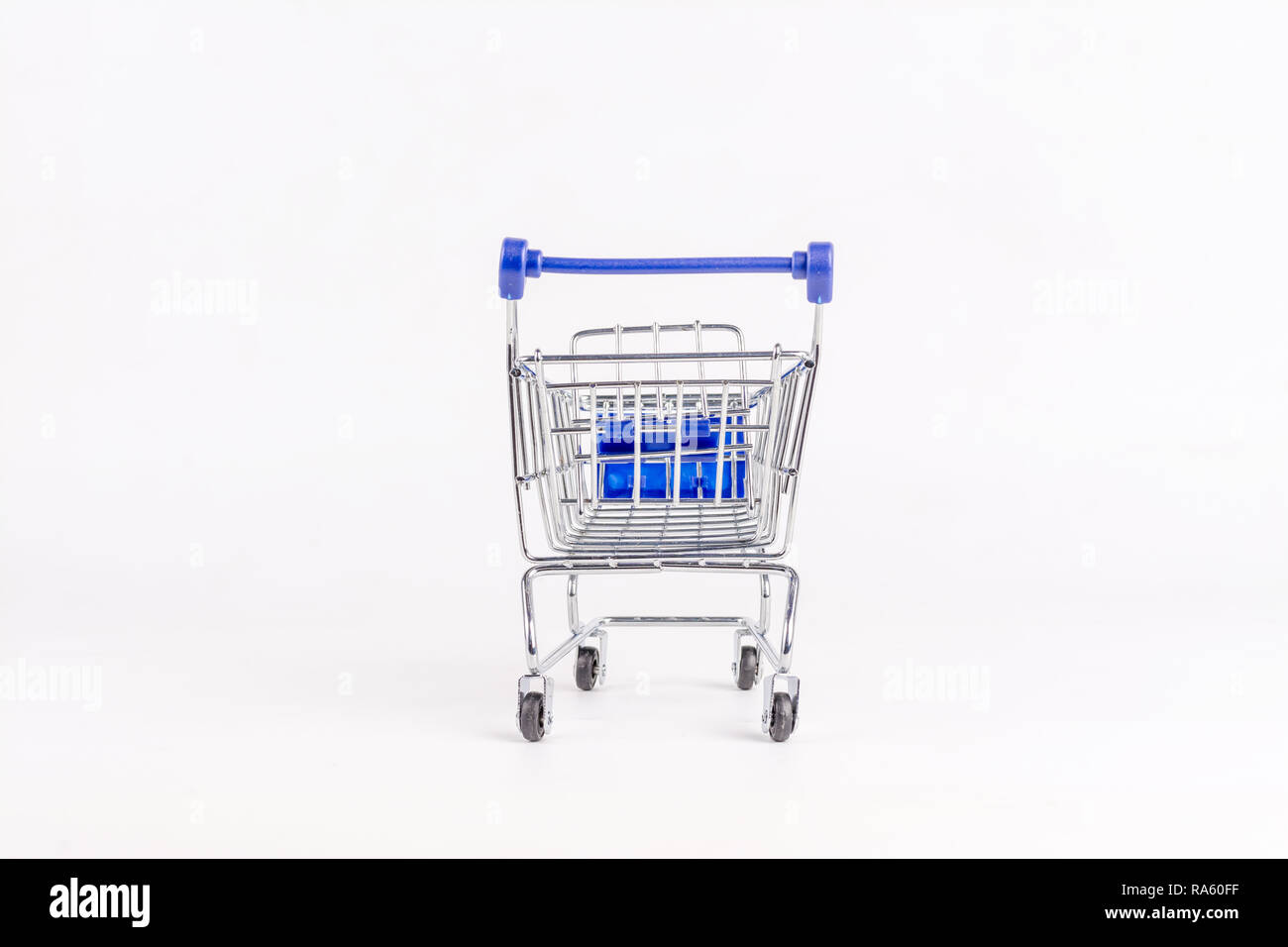 Shopping cart on white background Stock Photo - Alamy