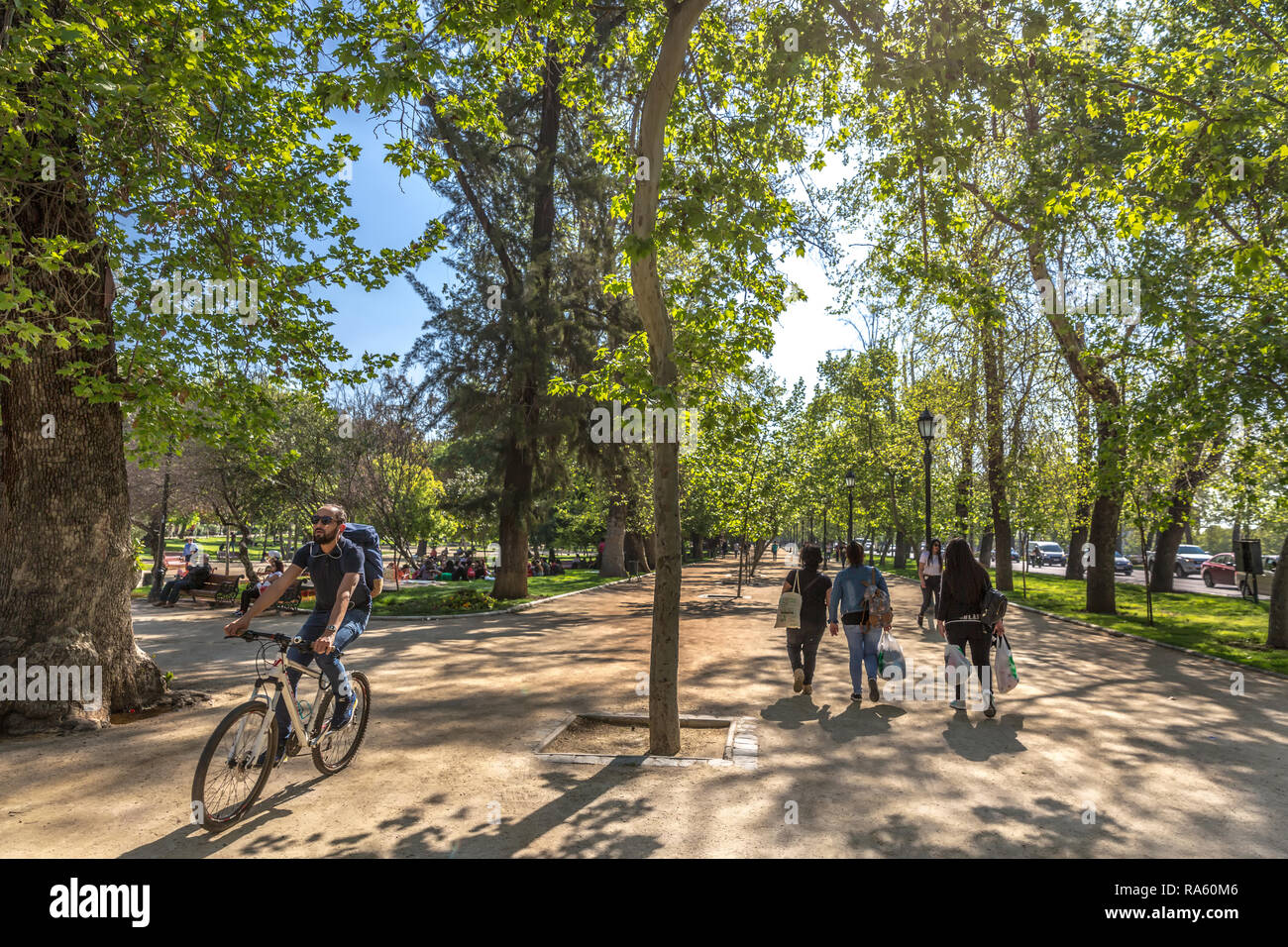 Santiago, Chile - Oct 1st 2017 - A guy in a bicycle and a group of ...