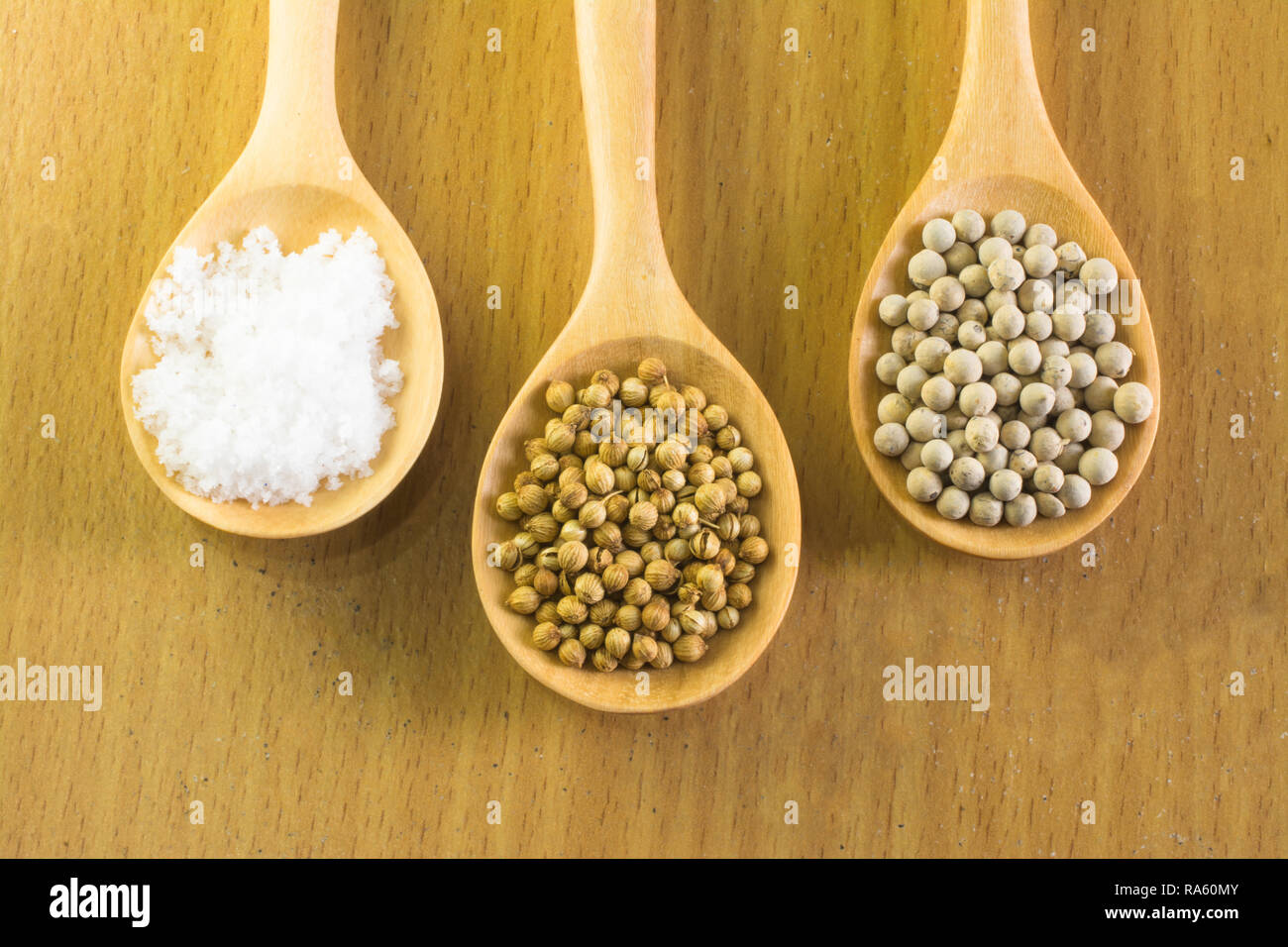 pepper and Salt and Coriander on the wood Stock Photo - Alamy