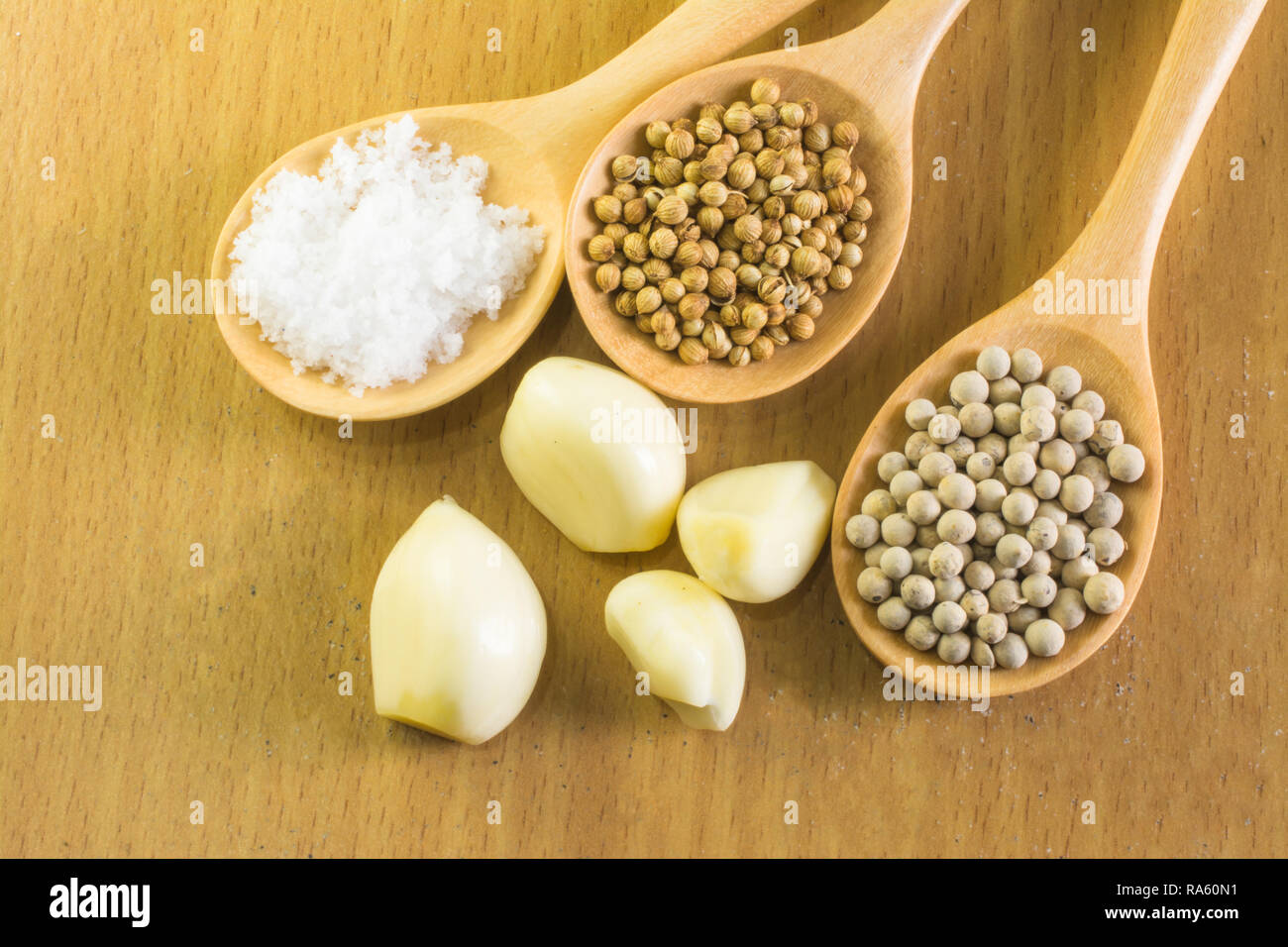 Garlic and pepper and Salt and Coriander on the wood Stock Photo - Alamy