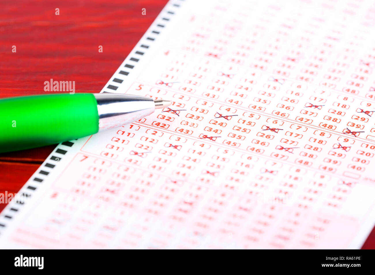 Lottery ticket with a pen Stock Photo - Alamy