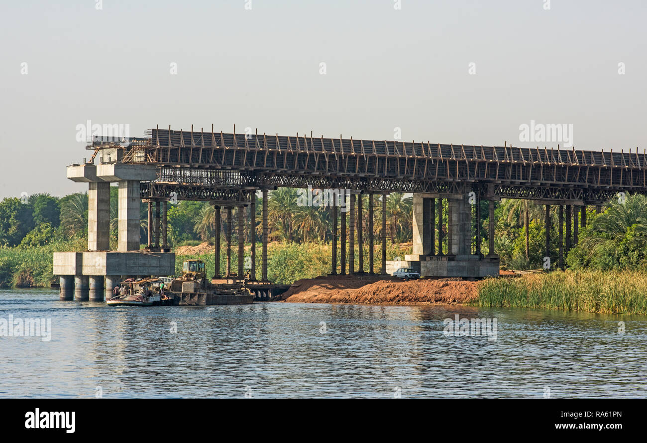 View of large concrete road bridge under construction spanning wide ...