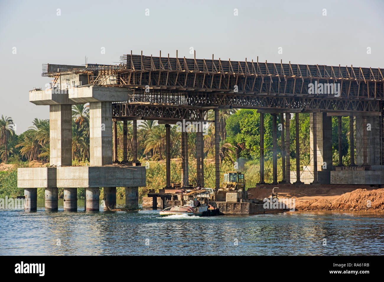 View of large concrete road bridge under construction spanning wide ...