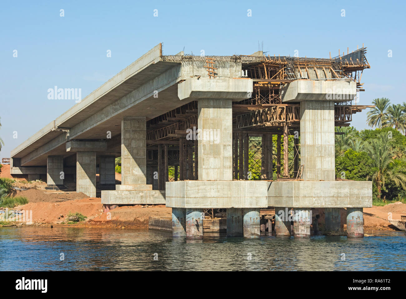 View of large concrete road bridge under construction spanning wide ...