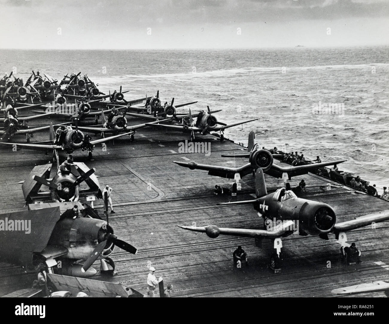 World War II - February 1944 - Corsairs moving up the flight deck for ...