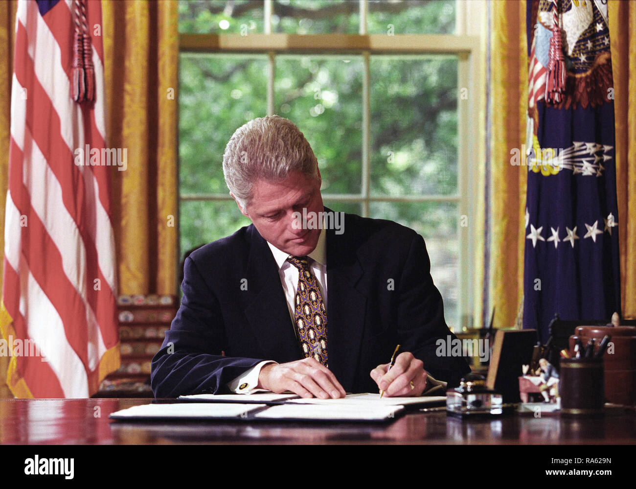 Bill clinton signing bill oval office hi-res stock photography and ...
