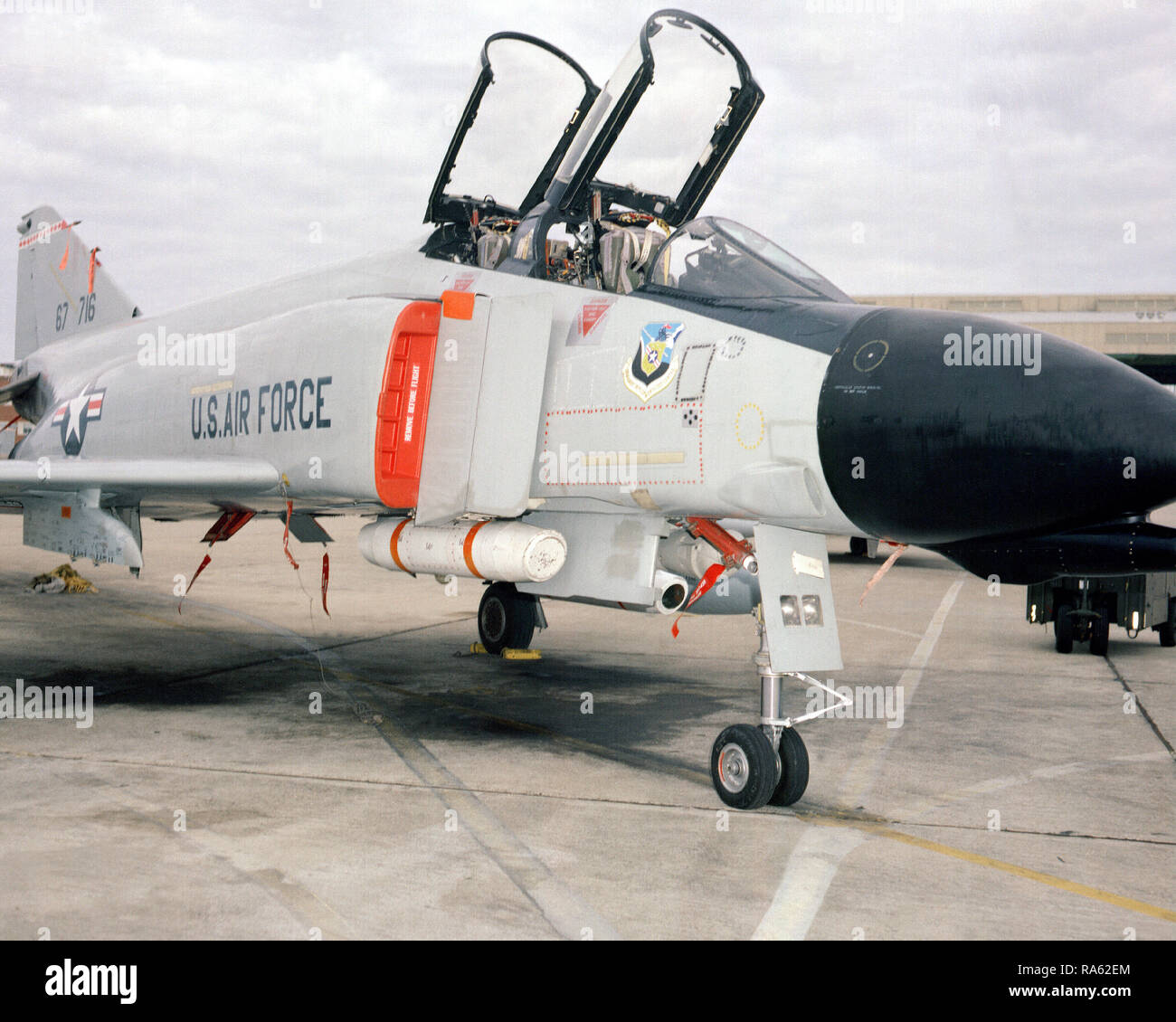 1976 - A right front view of an F-4C Phantom II aircraft loaded with a ...