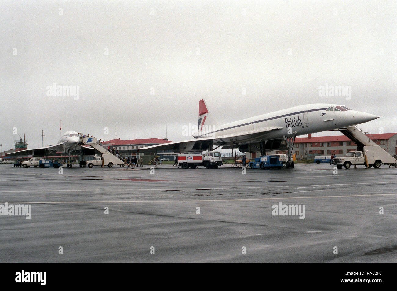 1977 A Right Front View Of Two British Airways Concorde Aircraft Parked On The Flight Line
