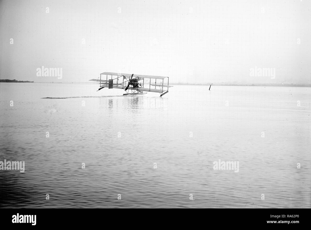 U.S. Navy Lieutenant Theodore Ellyson testing a seaplane on the Potomoc ...