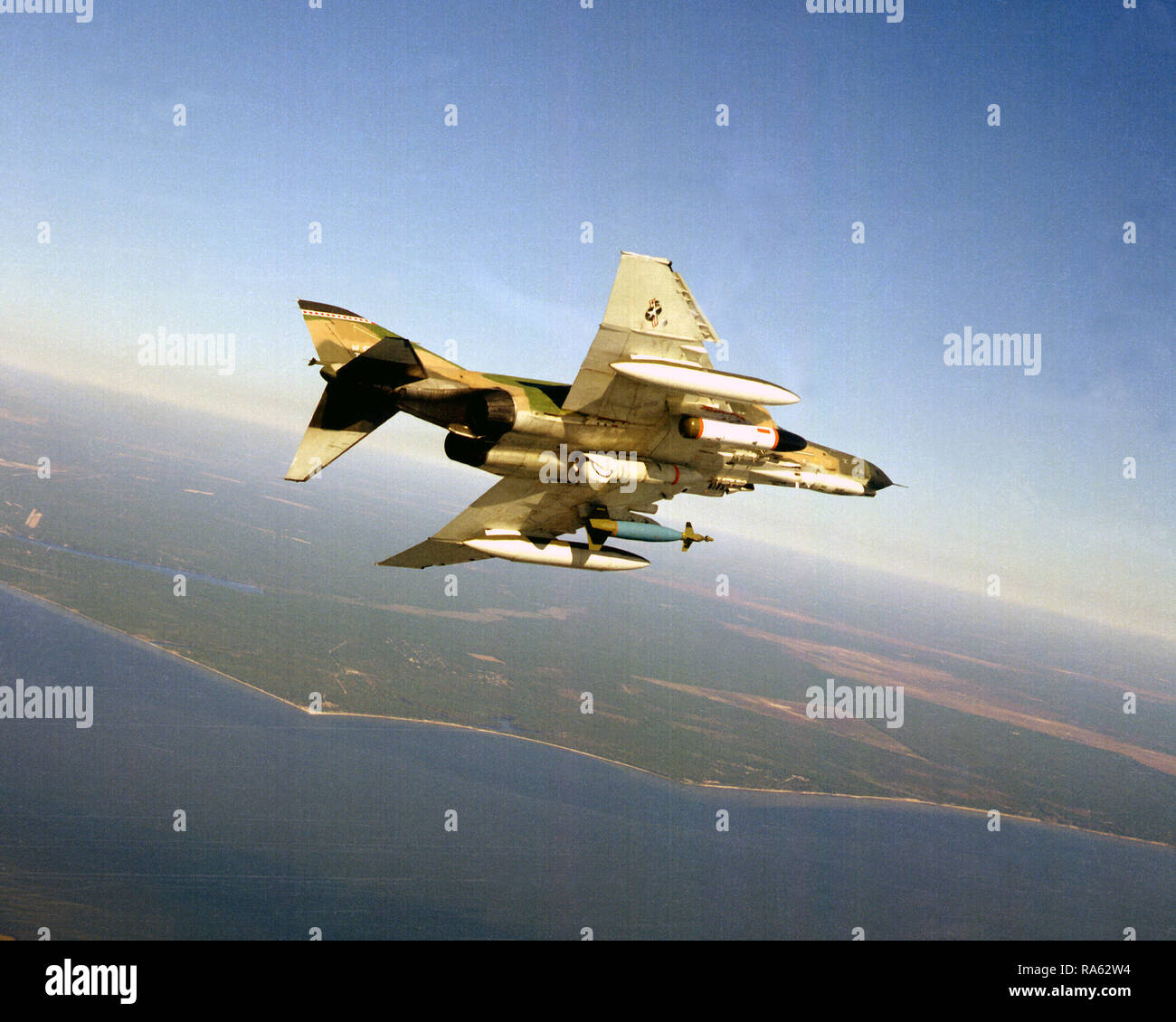 1976 - An air-to-air right underside view of an F-4E Phantom II ...