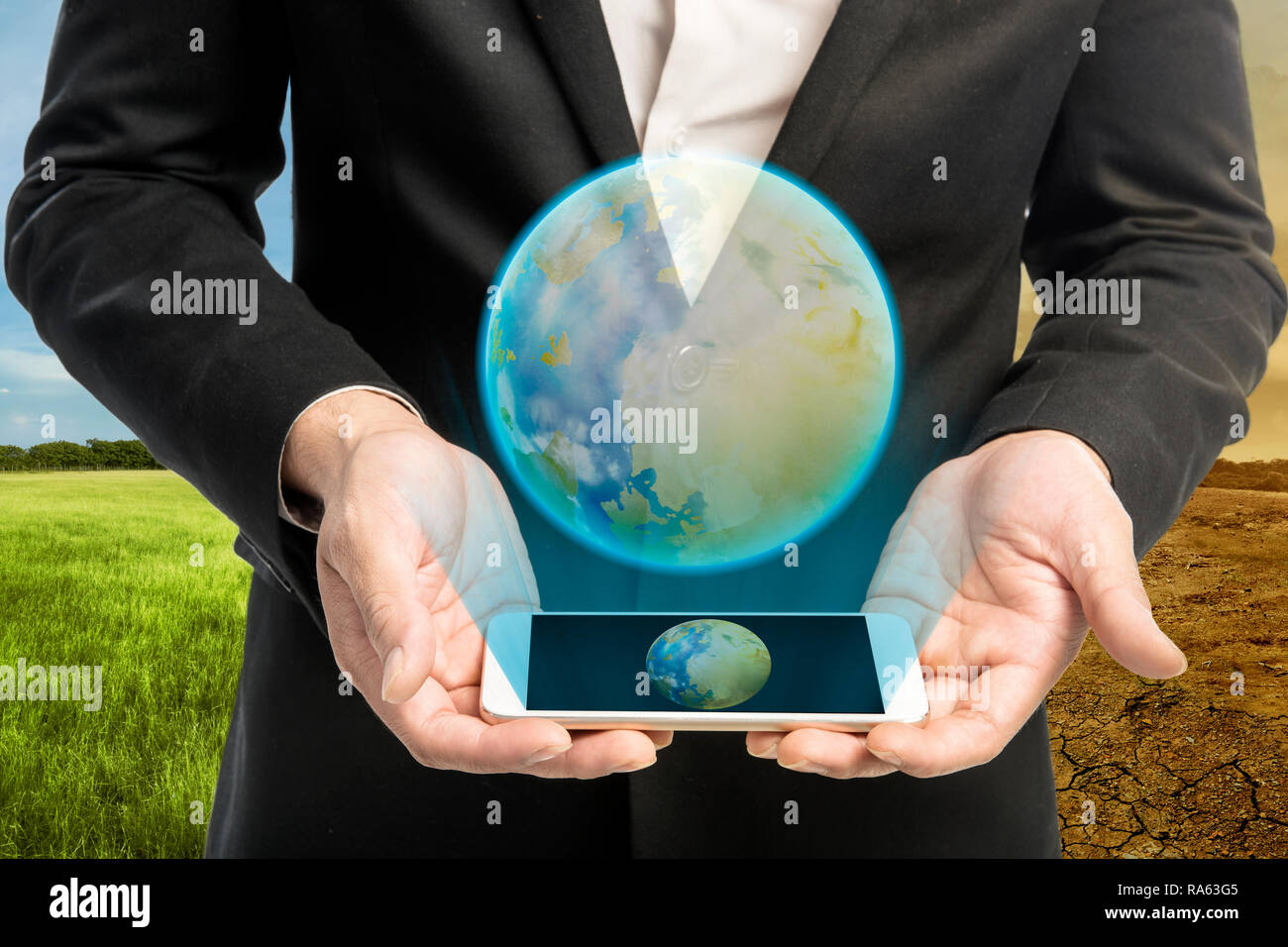 Businessman with virtual earth from mobile phone against climate change ...