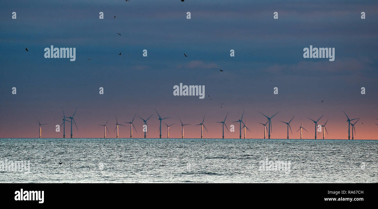 Brighton UK 1st January 2019 - The sun sets behind the the Rampion ...