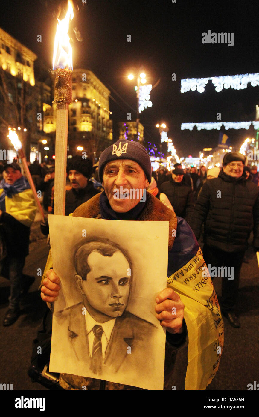 Kiev, Ukraine. 1st Jan, 2019. A man carries a portrait of Stepan ...