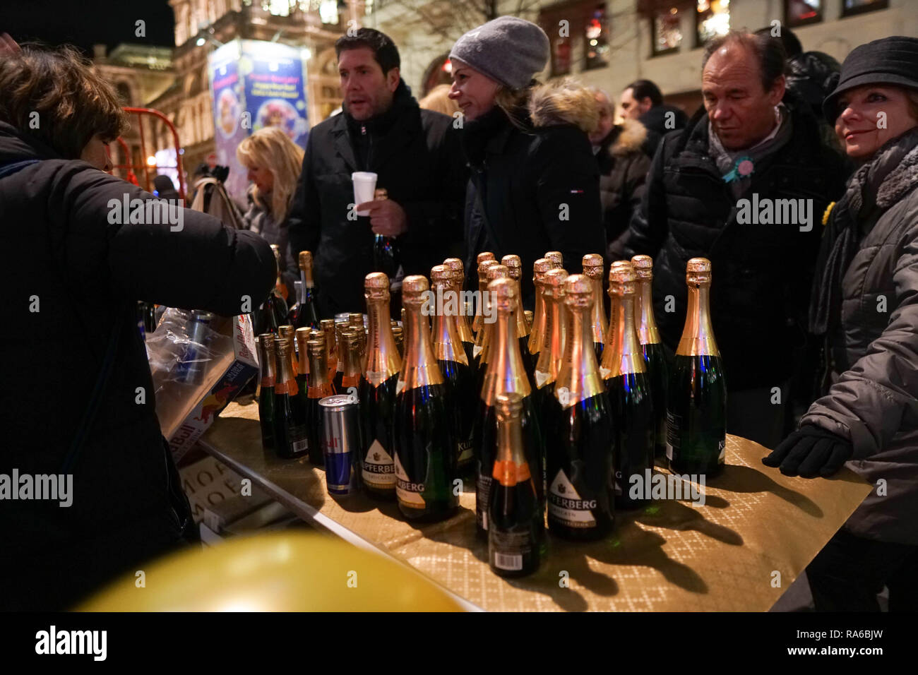 Tourists are seen preparing for the New Year's toast in Vienna. Several ...