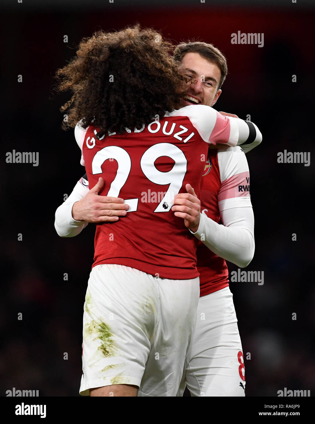 Arsenal's Aaron Ramsey (right) celebrates scoring his side's third goal ...