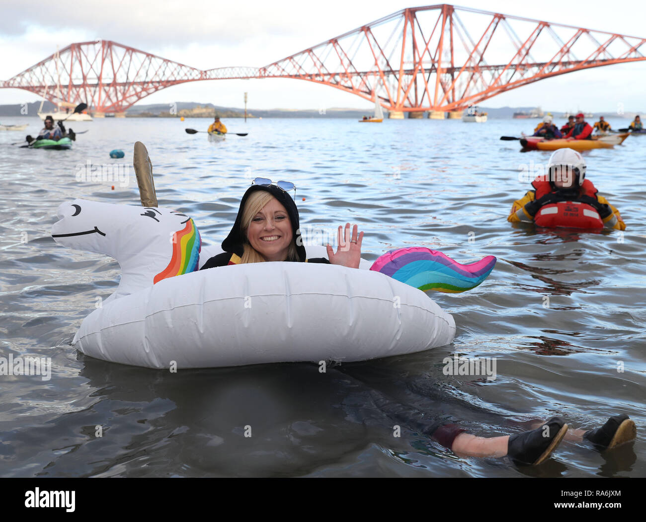 People take part in the annual Loony Dook swim in Firth of Forth ...