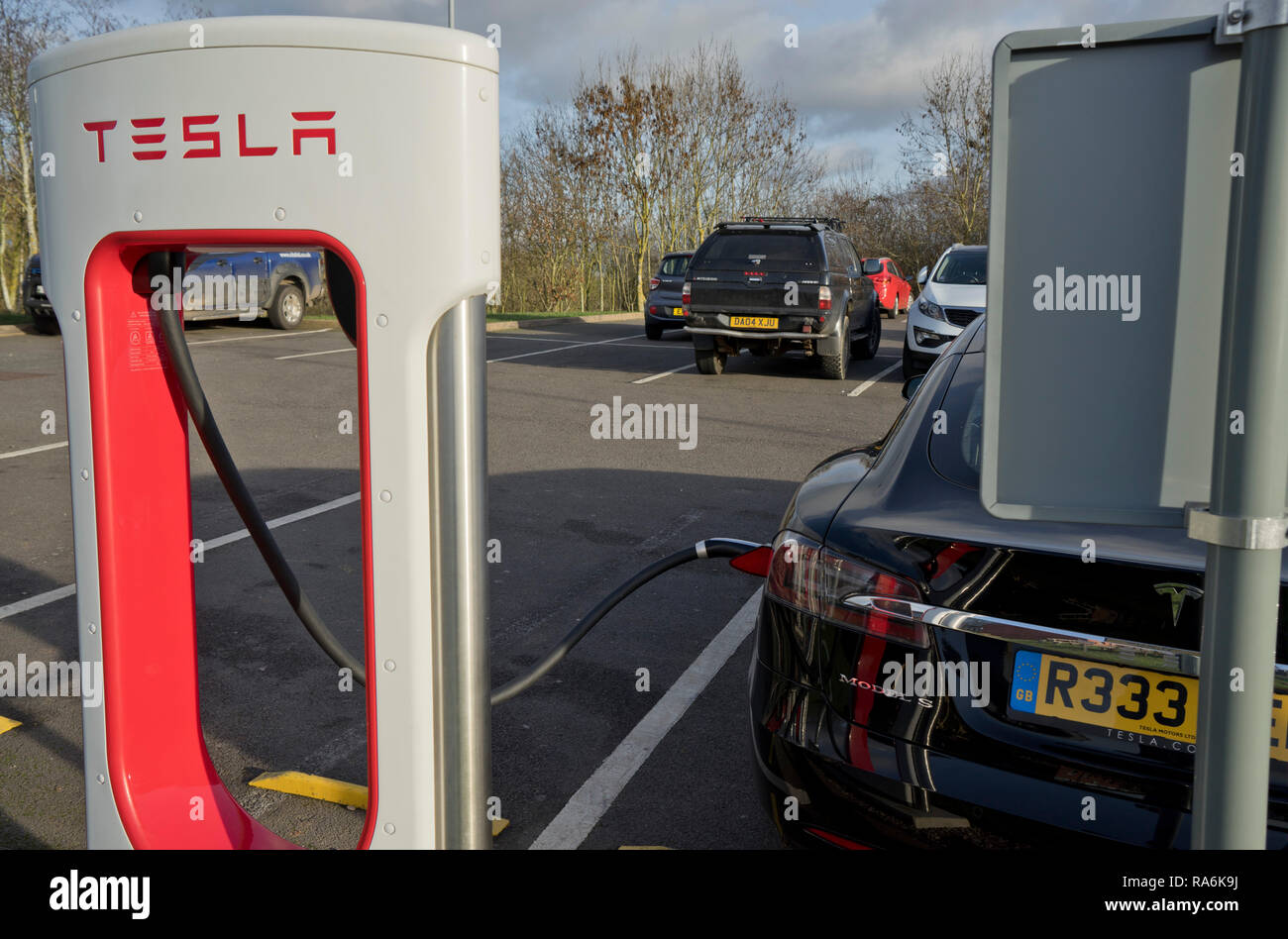 Tesla electric car charger machine at a motorway service station in ...