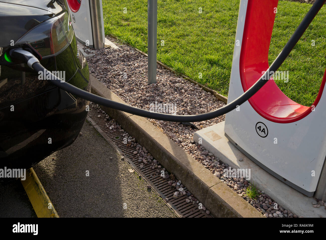 Tesla electric car charger machine at a motorway service station in ...