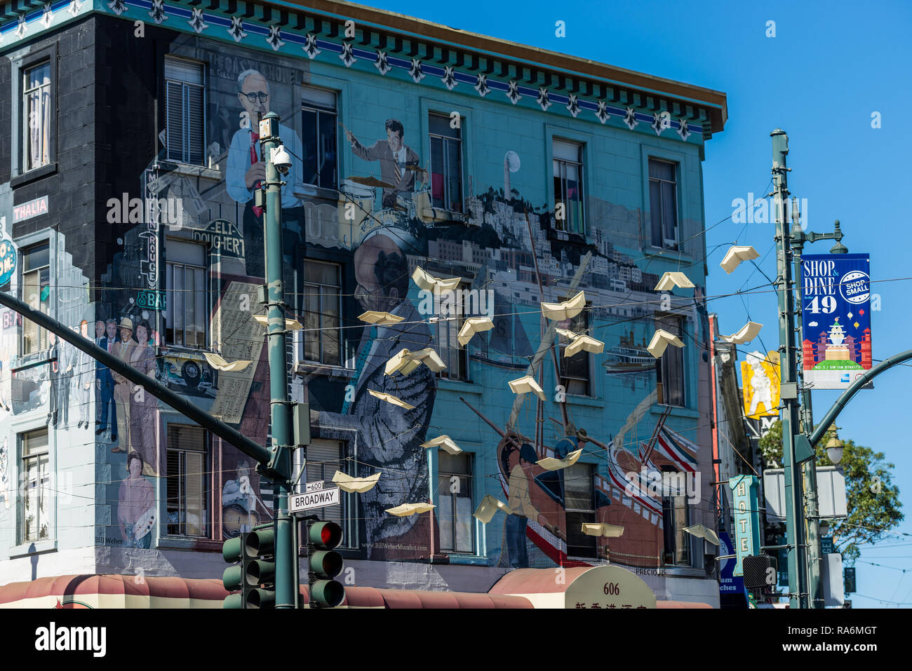 Beautiful graffiti mural on the wall and some flying books hanging ...