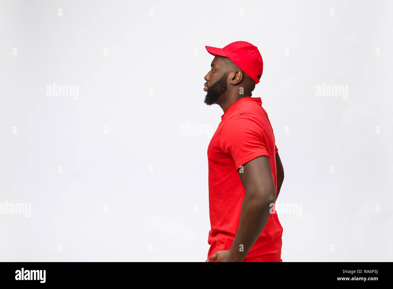 Delivery Concept - Side View Handsome African American delivery man ...