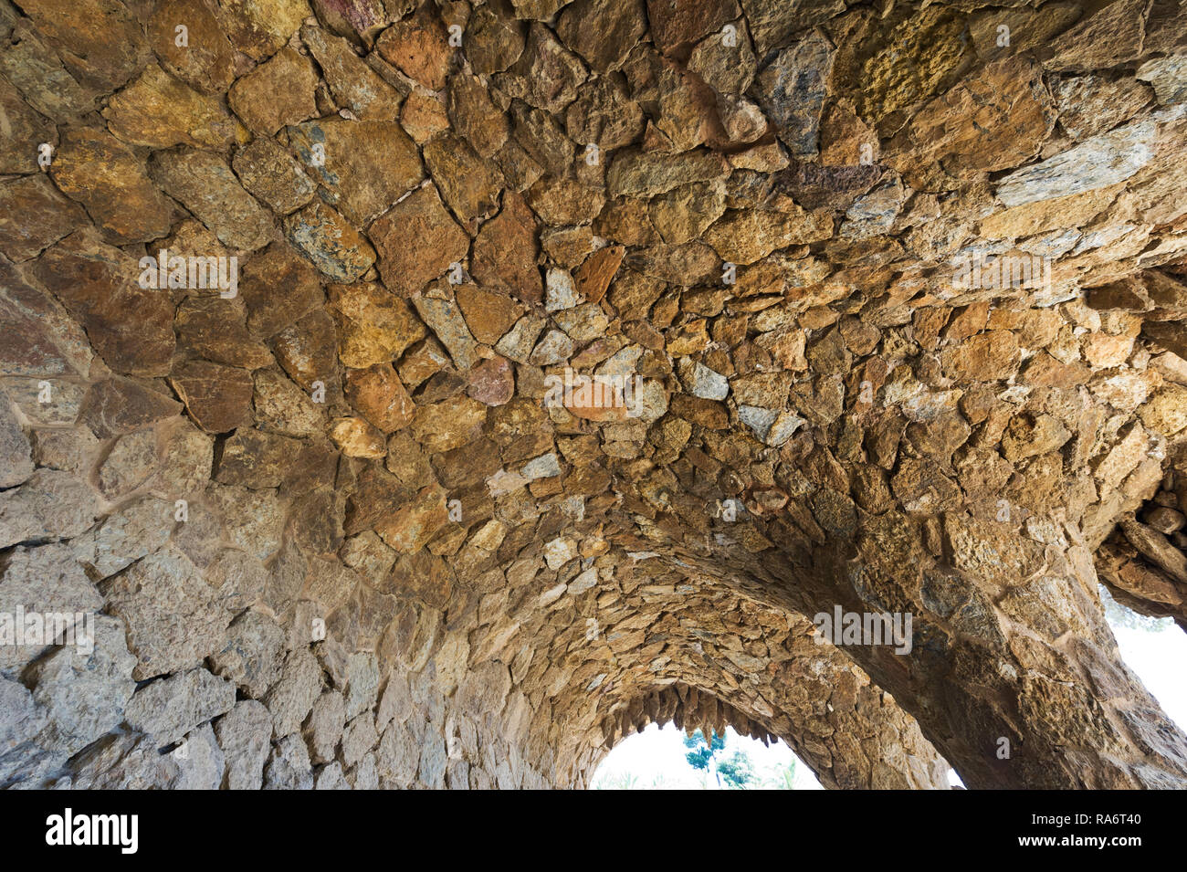 Stoney arches and walkways designed by Antoni Gaudi at the Park Guell ...
