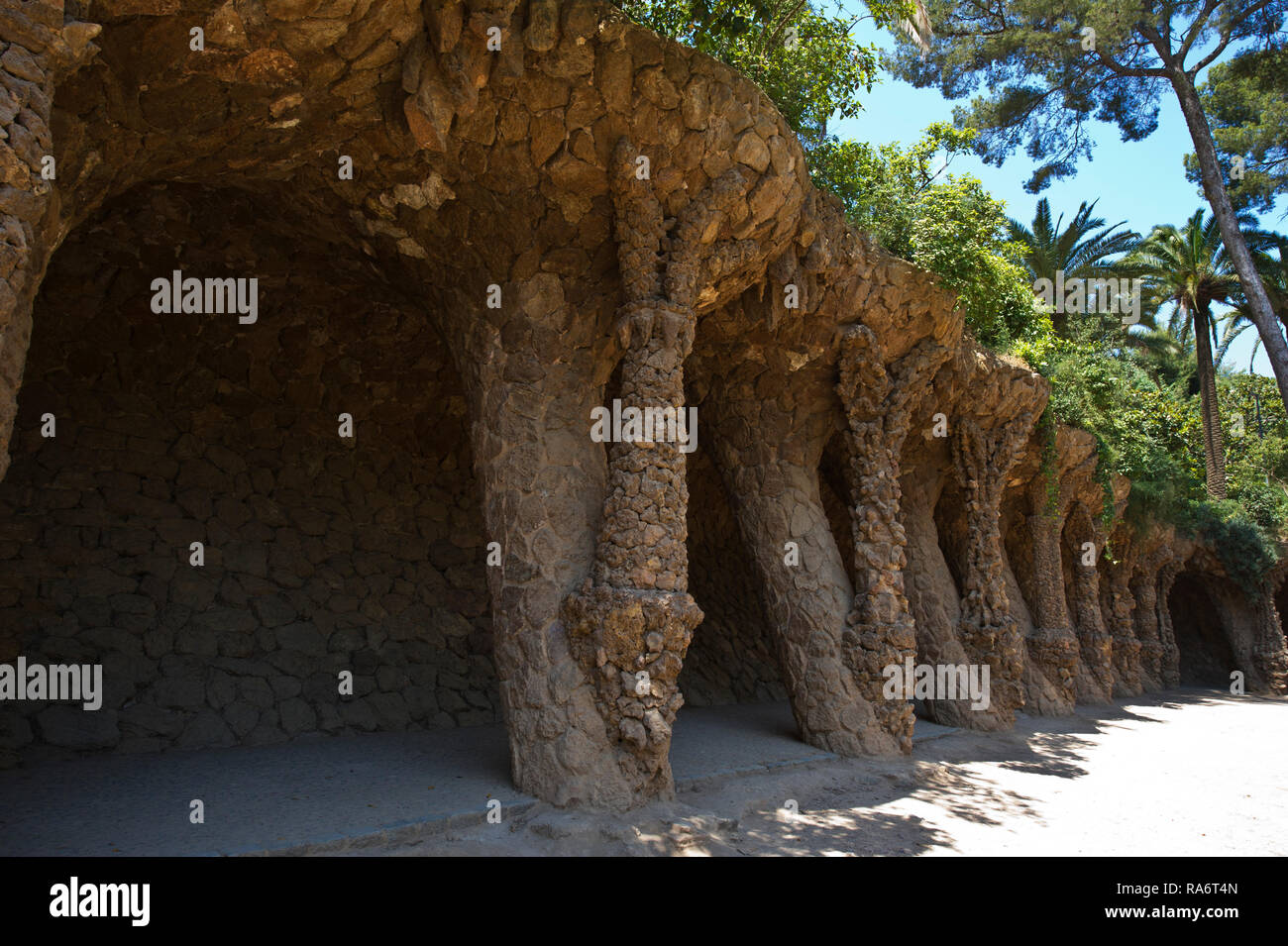 Stoney arches and building designed by Antoni Gaudi at the Park Guell ...