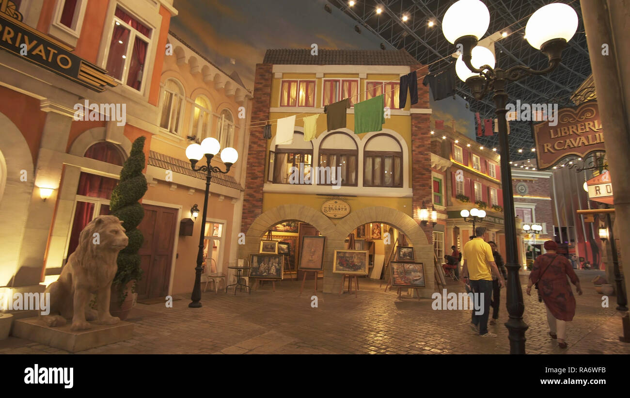 Italian street of cafes and shops in the theme park Ferrari World Abu ...