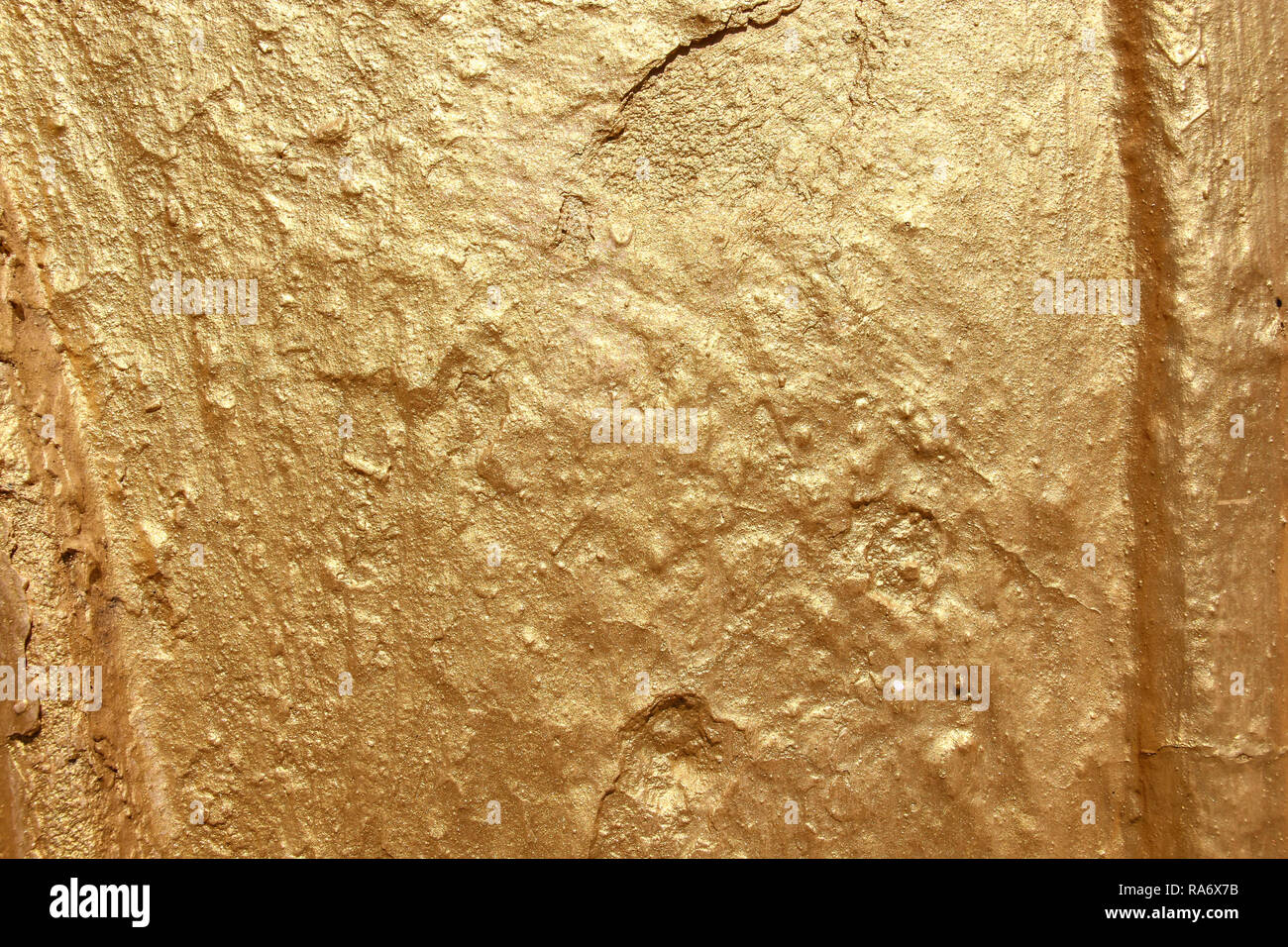 Texture and background wall in gold color with surface irregularities ... Texture and background wall in gold color with surface irregularities ...