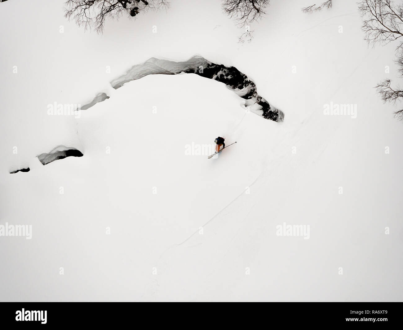 Freerider skier lost his balance and fell into the snow during the ...