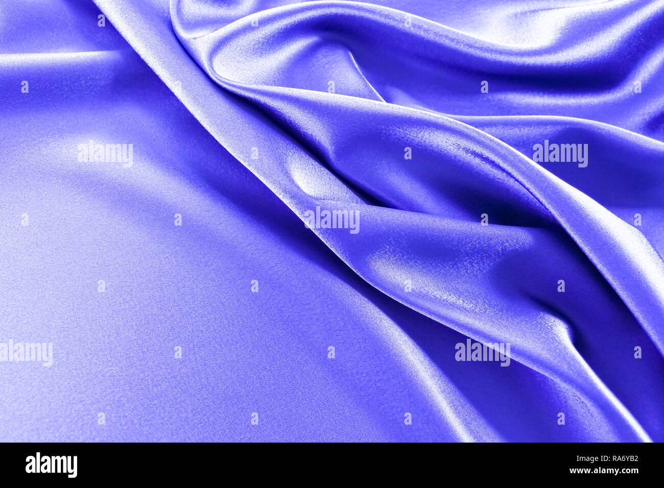 Smooth elegant wavy blue silk or satin luxury cloth fabric texture ...