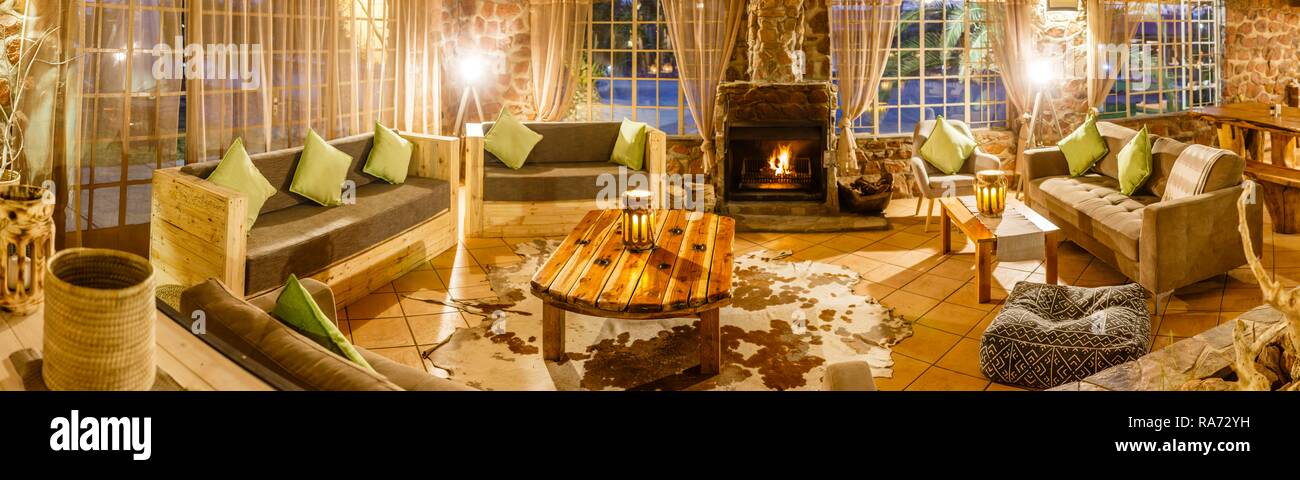 Sitting by fireplace hi-res stock photography and images - Alamy