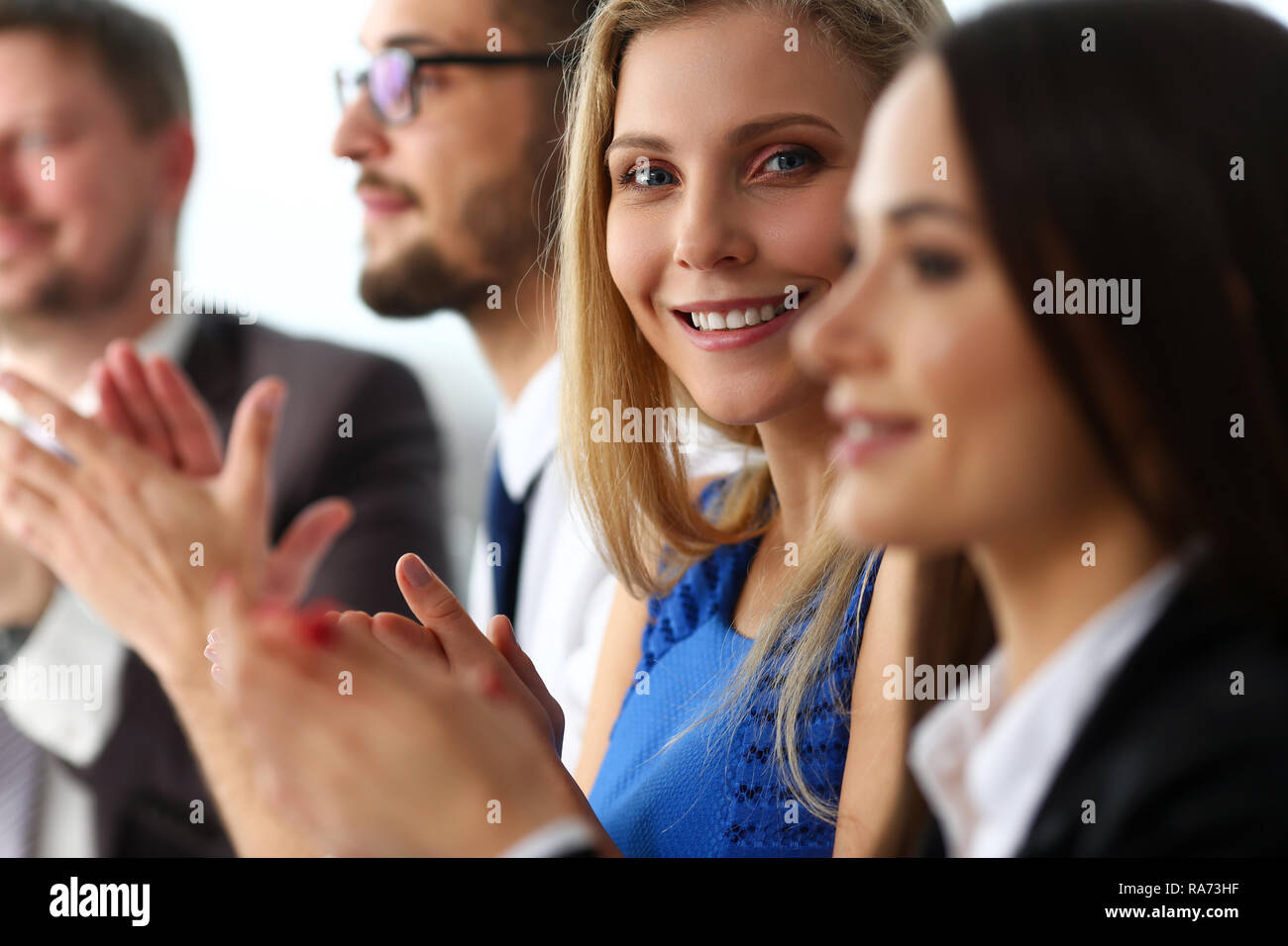 Group of people clap their arm in row Stock Photo - Alamy