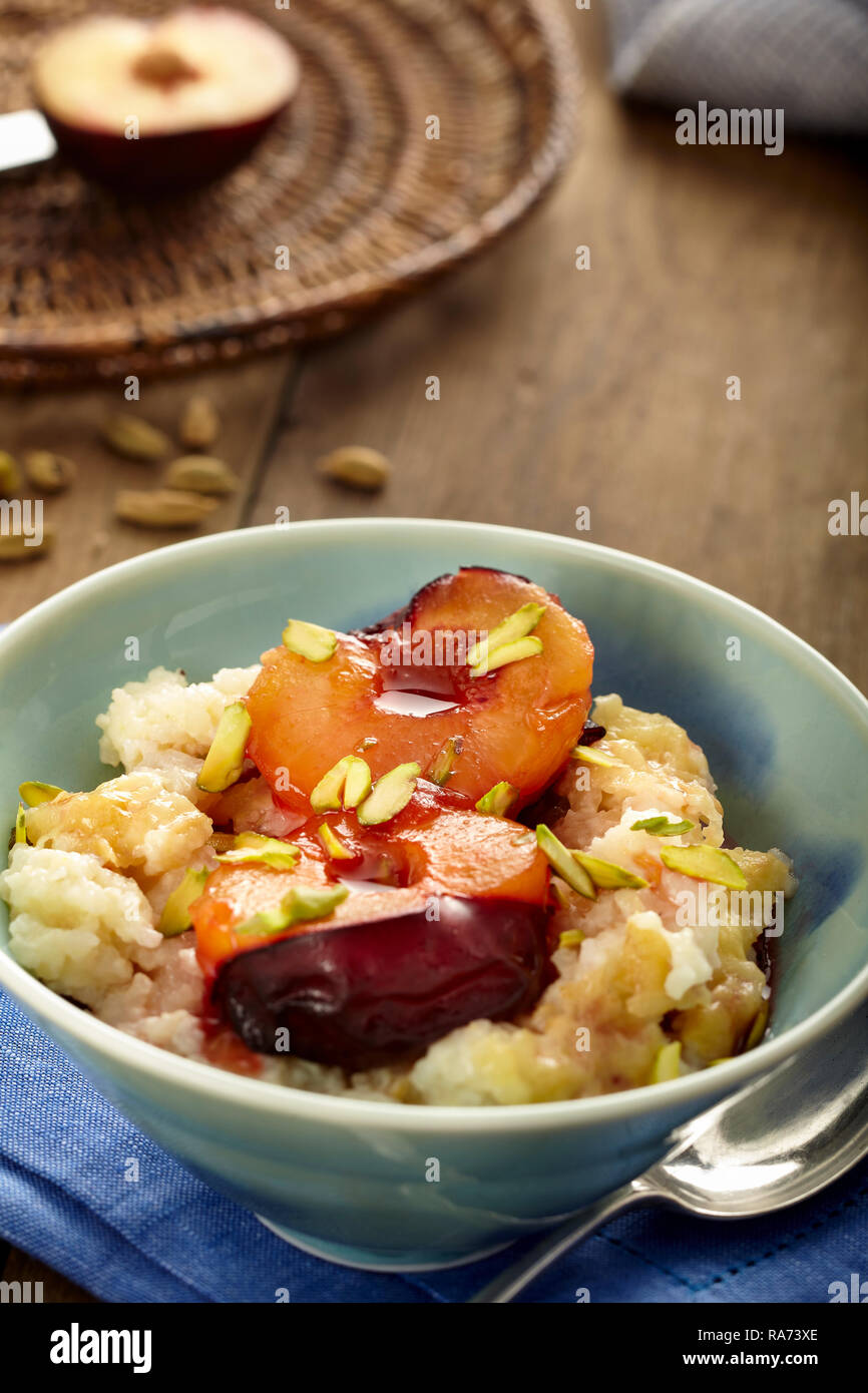 Cardamom rice pudding with plum compote Stock Photo - Alamy