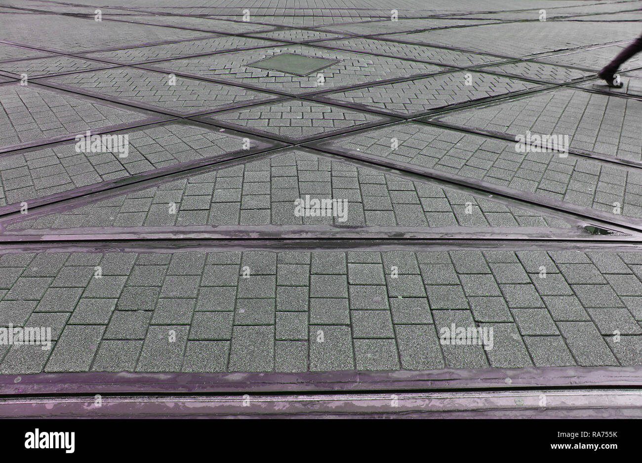 Geometrical pattern of tram tracks and pedestrian in ancient town of ...